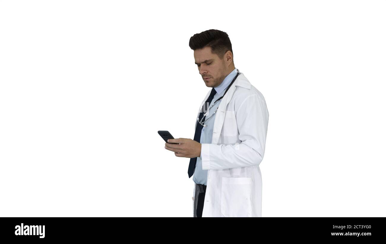 Doctor making a serious phone call on white background Stock Photo - Alamy