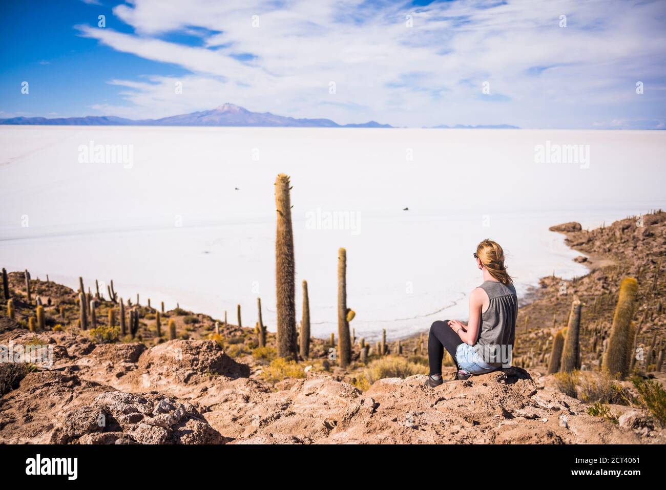 Tourist on cactus covered Fish Island (Isla Incahuasi or Inka Wasi ...
