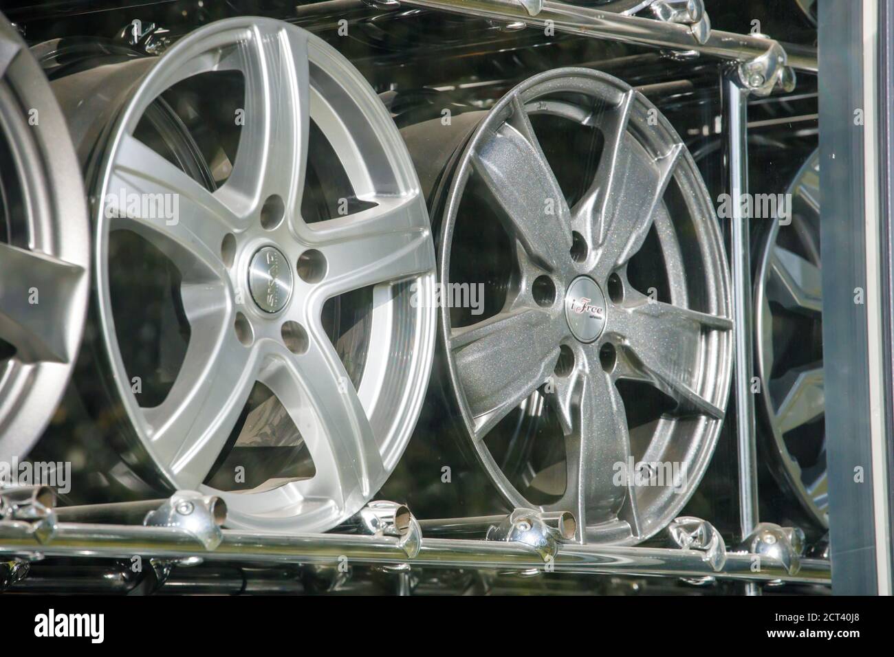 Russia Vyborg. 09.09.2020 Car rims in the shop window behind the glass ...