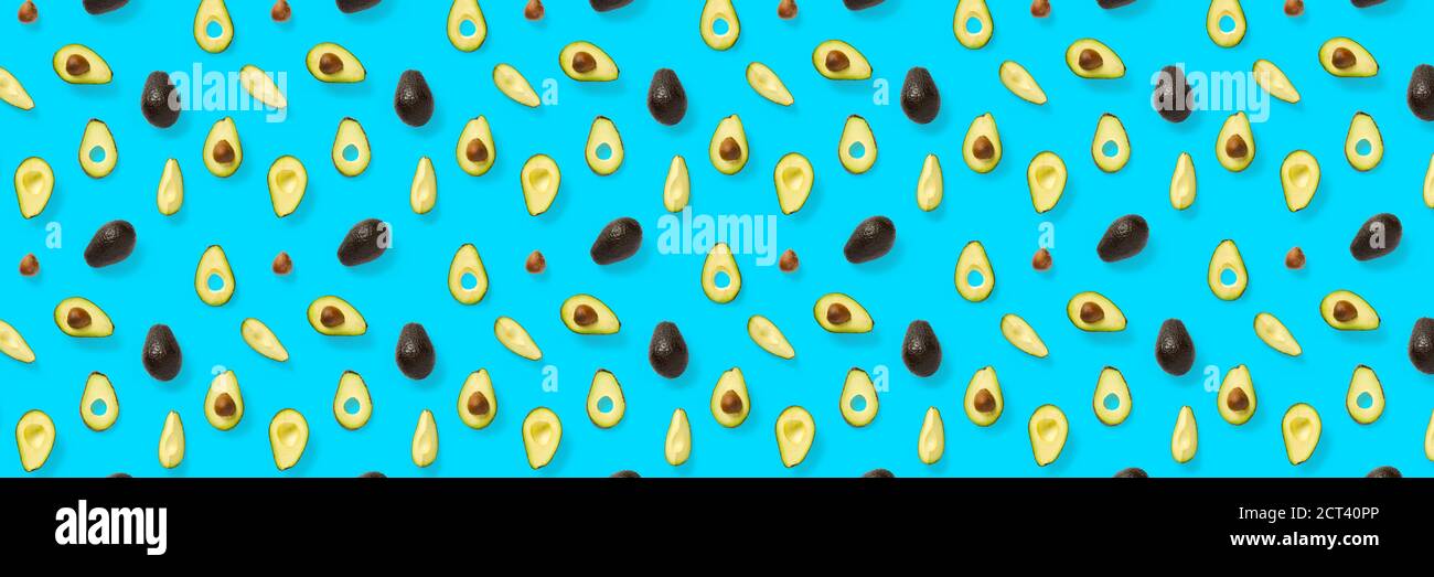 Avocado banner. Background made from isolated Avocado pieces on blue ...