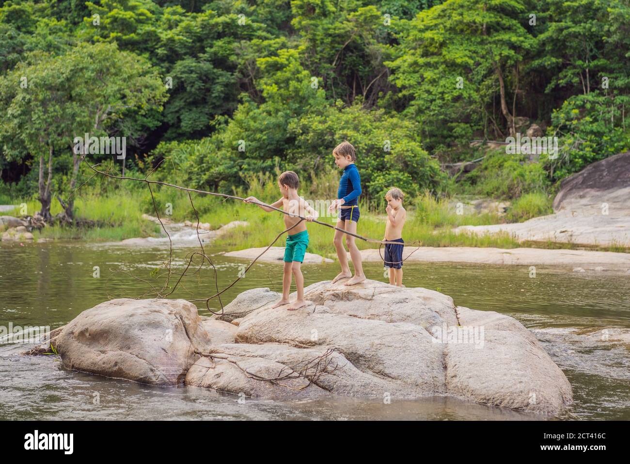 Two boys play in river hi-res stock photography and images - Alamy