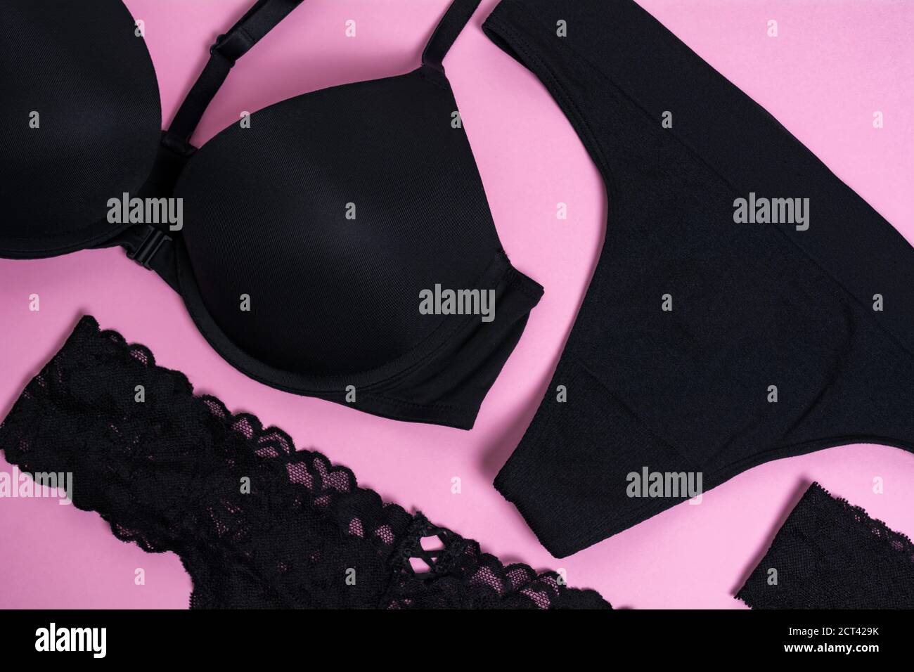 Women's underwear on a pink background. Black lace. Flat lay, view from ...