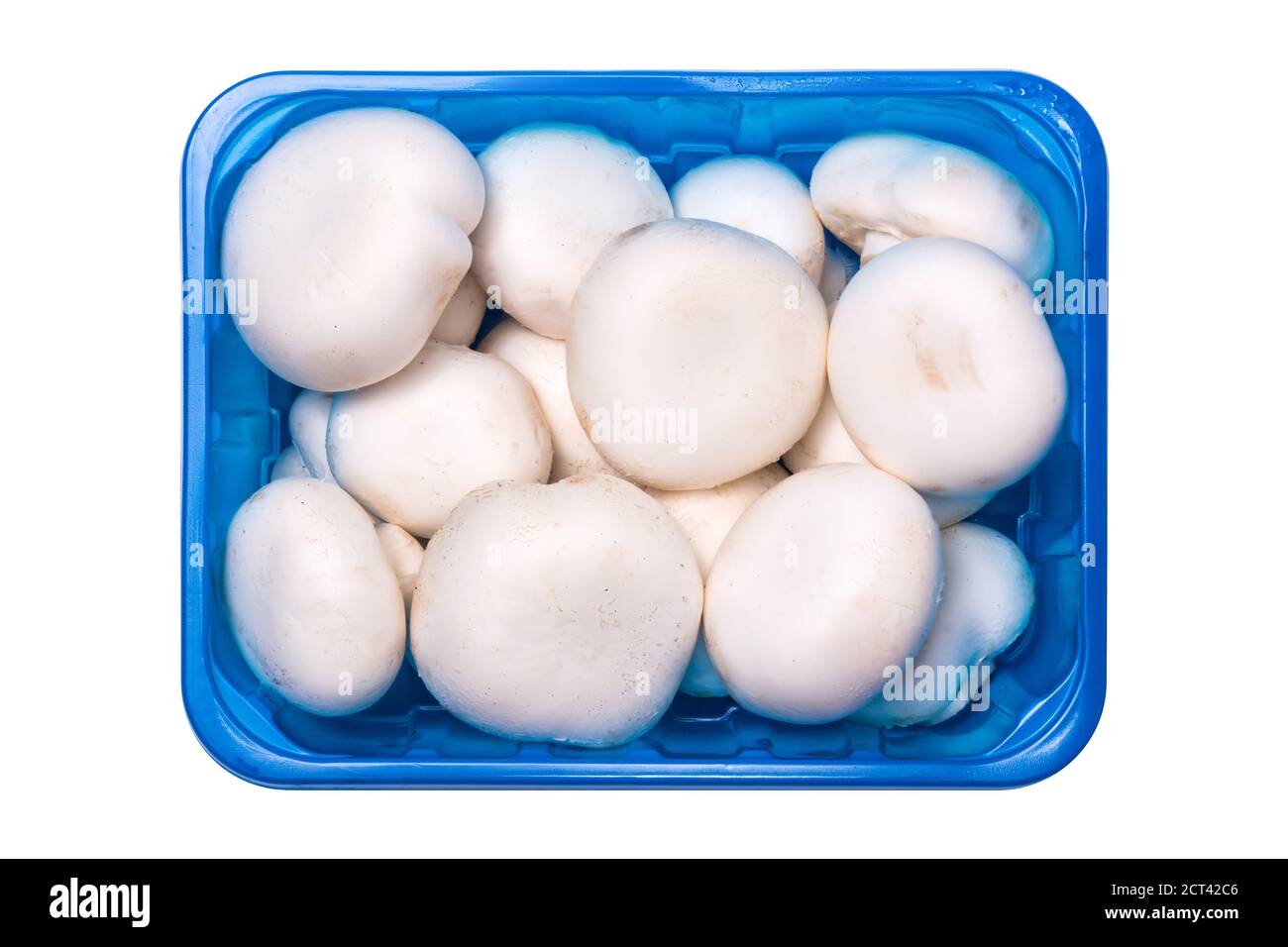 Fresh champignon mushrooms in a plastic container isolated on white ...
