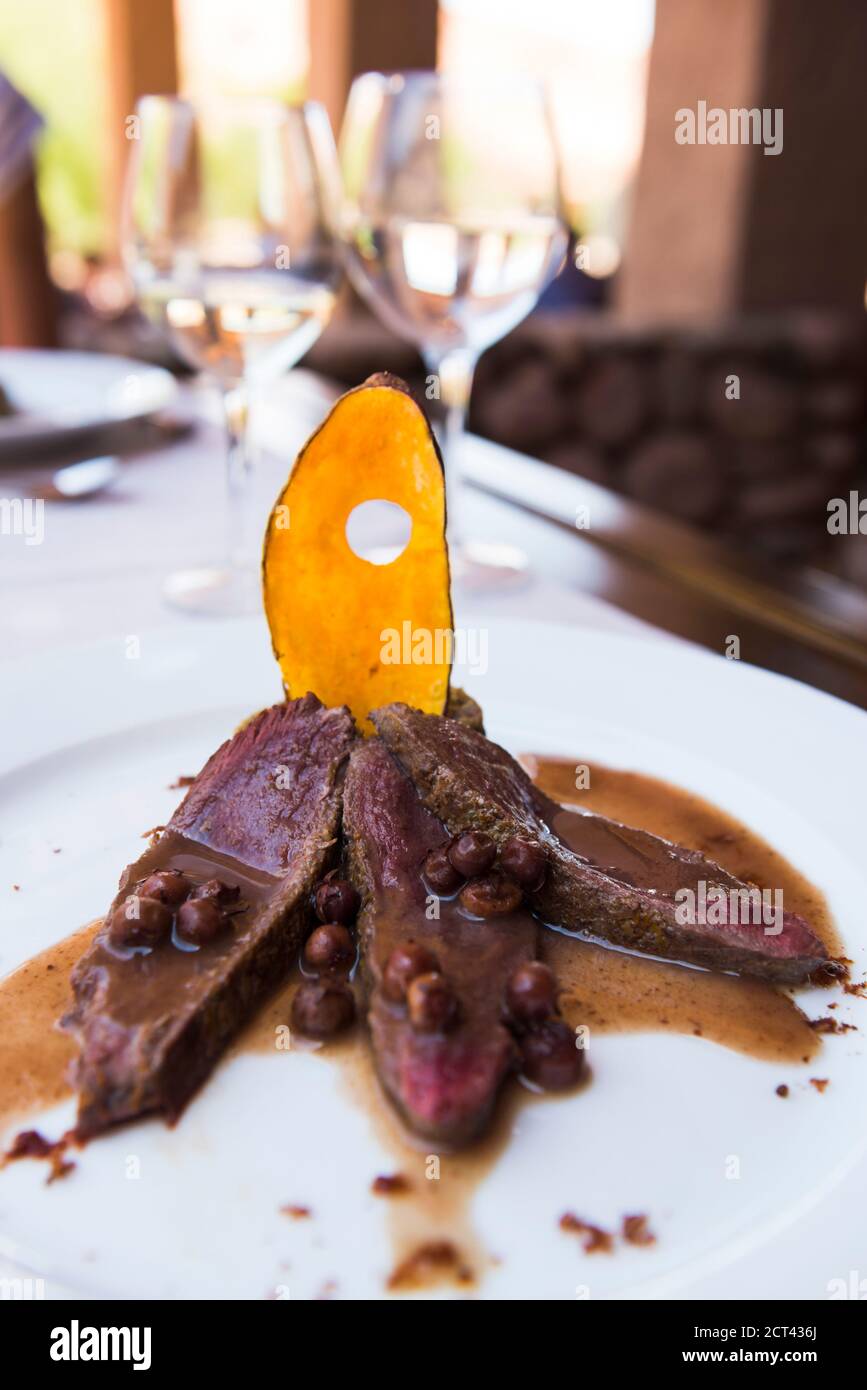 Delicious ostrich steak on a table for dinner at a fine dining luxury ...