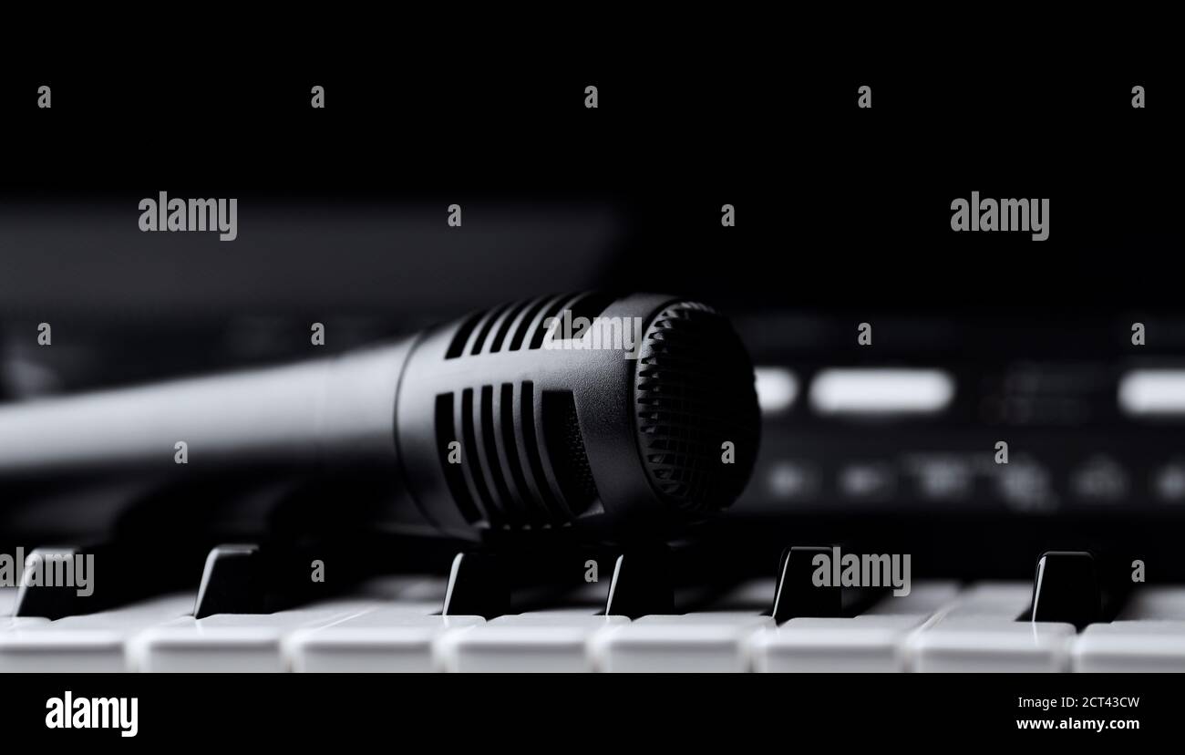Microphone on keyboard . Close up Stock Photo - Alamy
