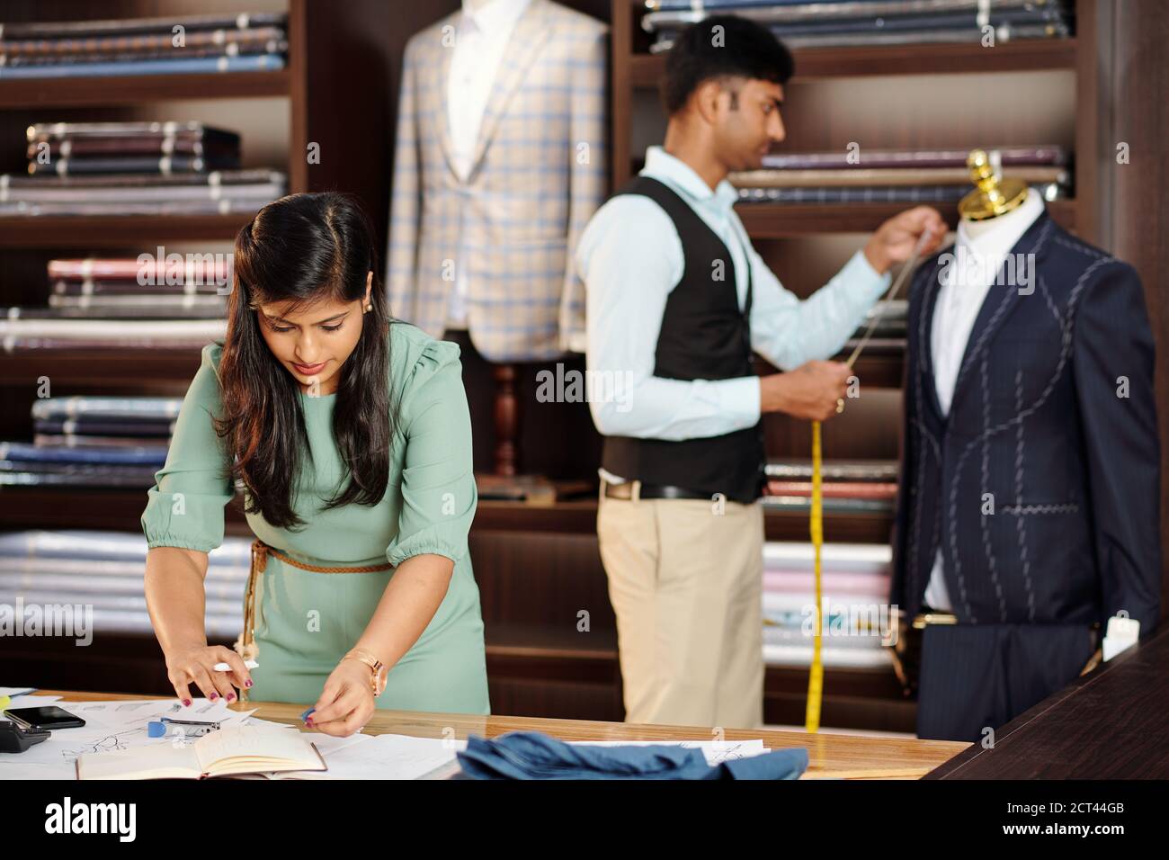 Tailors working on bespoke suit Stock Photo - Alamy