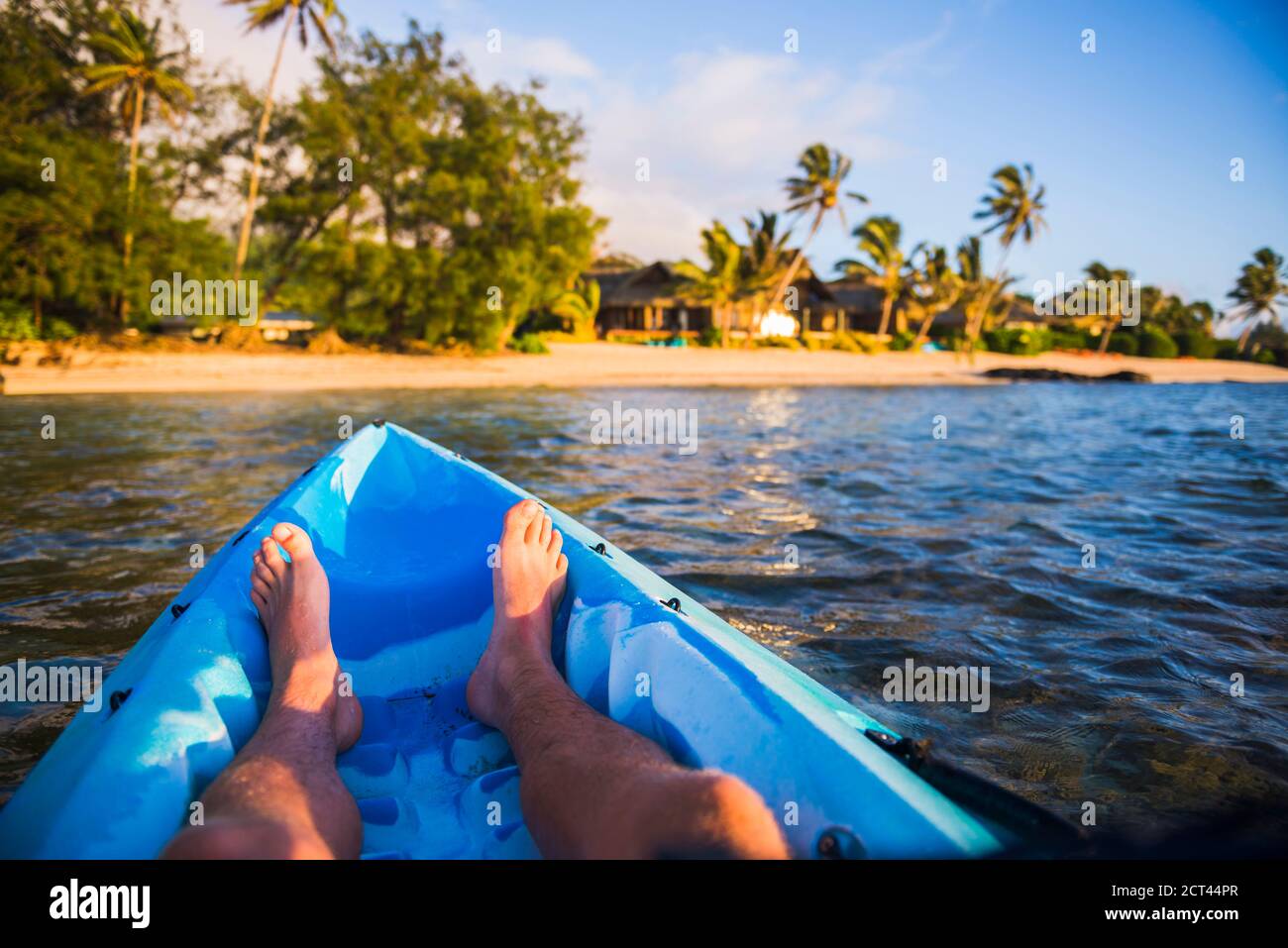 Kayaking at sunrise in Muri Lagoon, Rarotonga, Cook Islands, Pacific ...