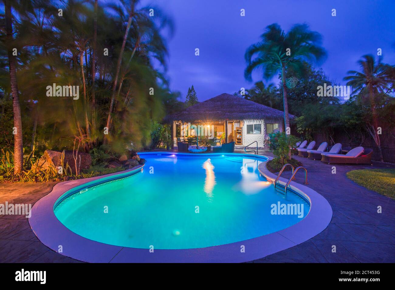Luxury villa and hotel accommodation swimming pool at night, Rarotonga ...