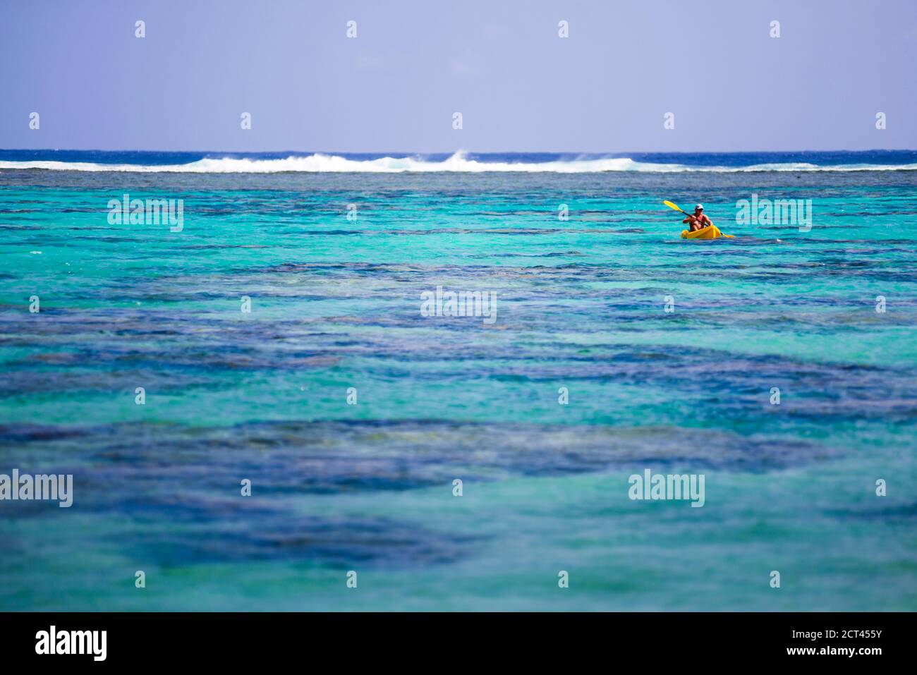 Kayaking in the beautiful blue tropical ocean of Titikaveka Lagoon ...