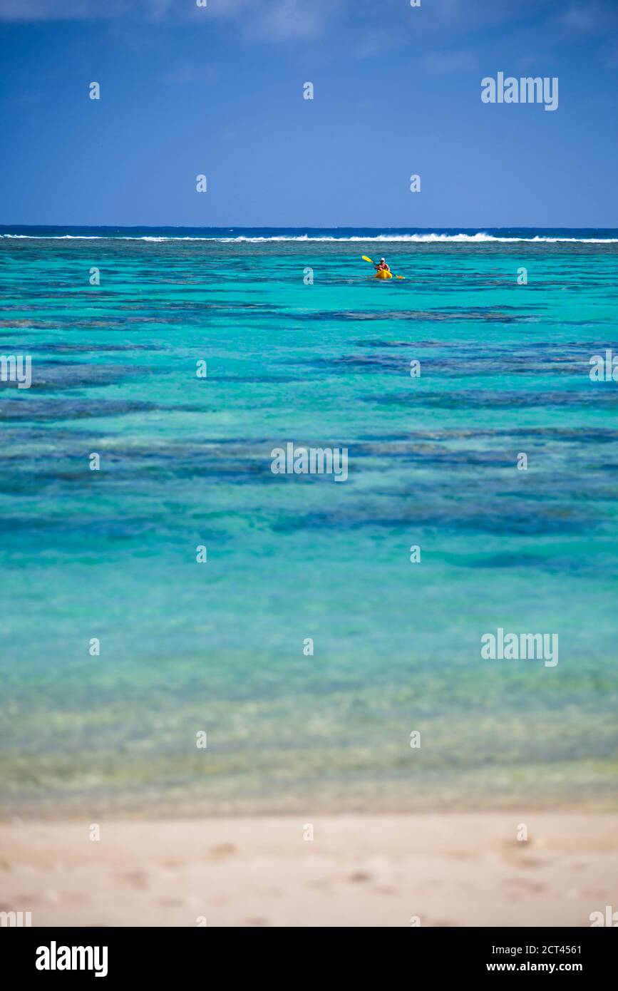 Kayaking in the beautiful blue tropical ocean of Titikaveka Lagoon ...