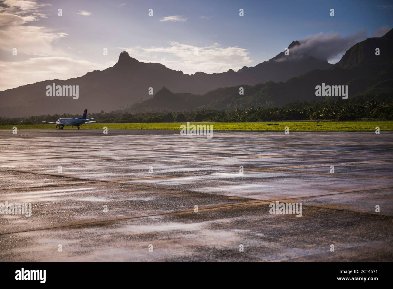 Airplane on the runway at the airport on the tropical island of ...