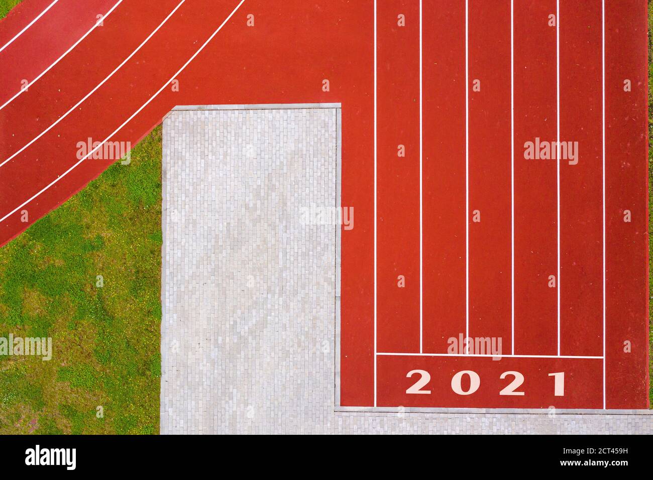 top down view of red running tracks start with number 2021 and green ...