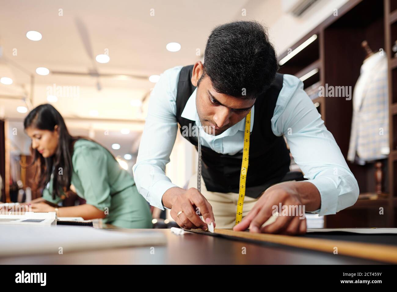 Tailors working in atelier Stock Photo - Alamy