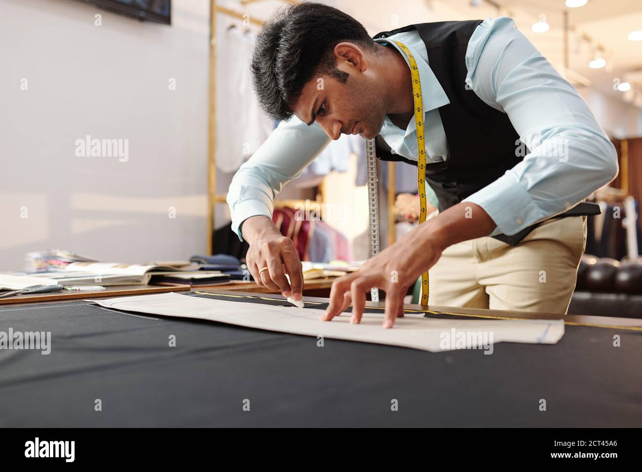 Tailor tracing sewing pattern Stock Photo - Alamy