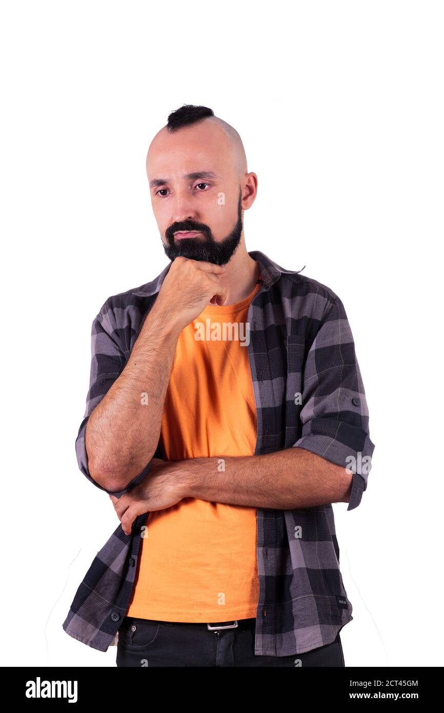 Worried young hispanic man immerse in deep thinking Stock Photo - Alamy