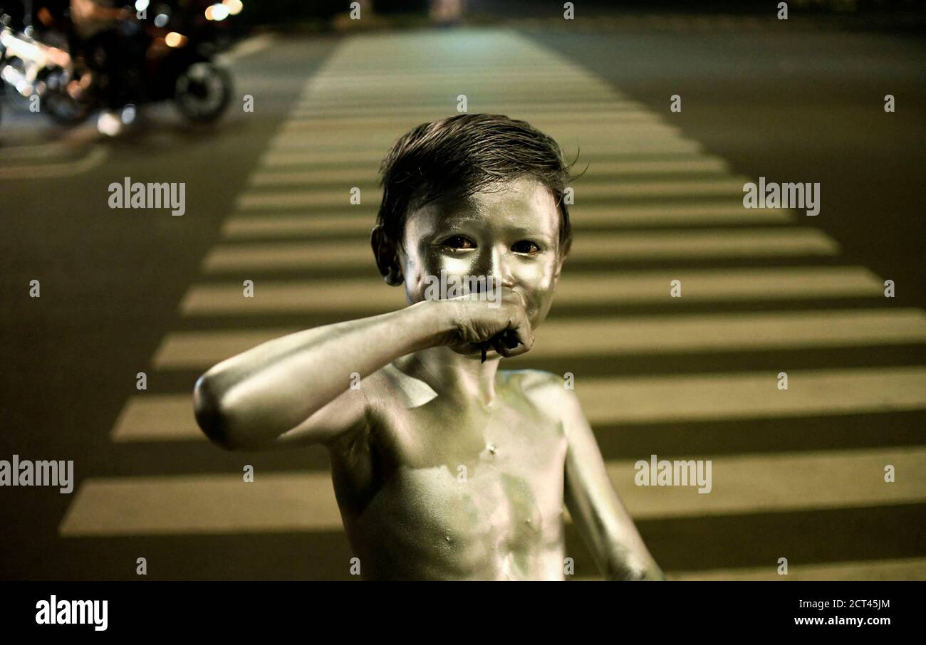 Jakarta, Indonesia. 20th Sep, 2020. A child wearing silver paint in a ...