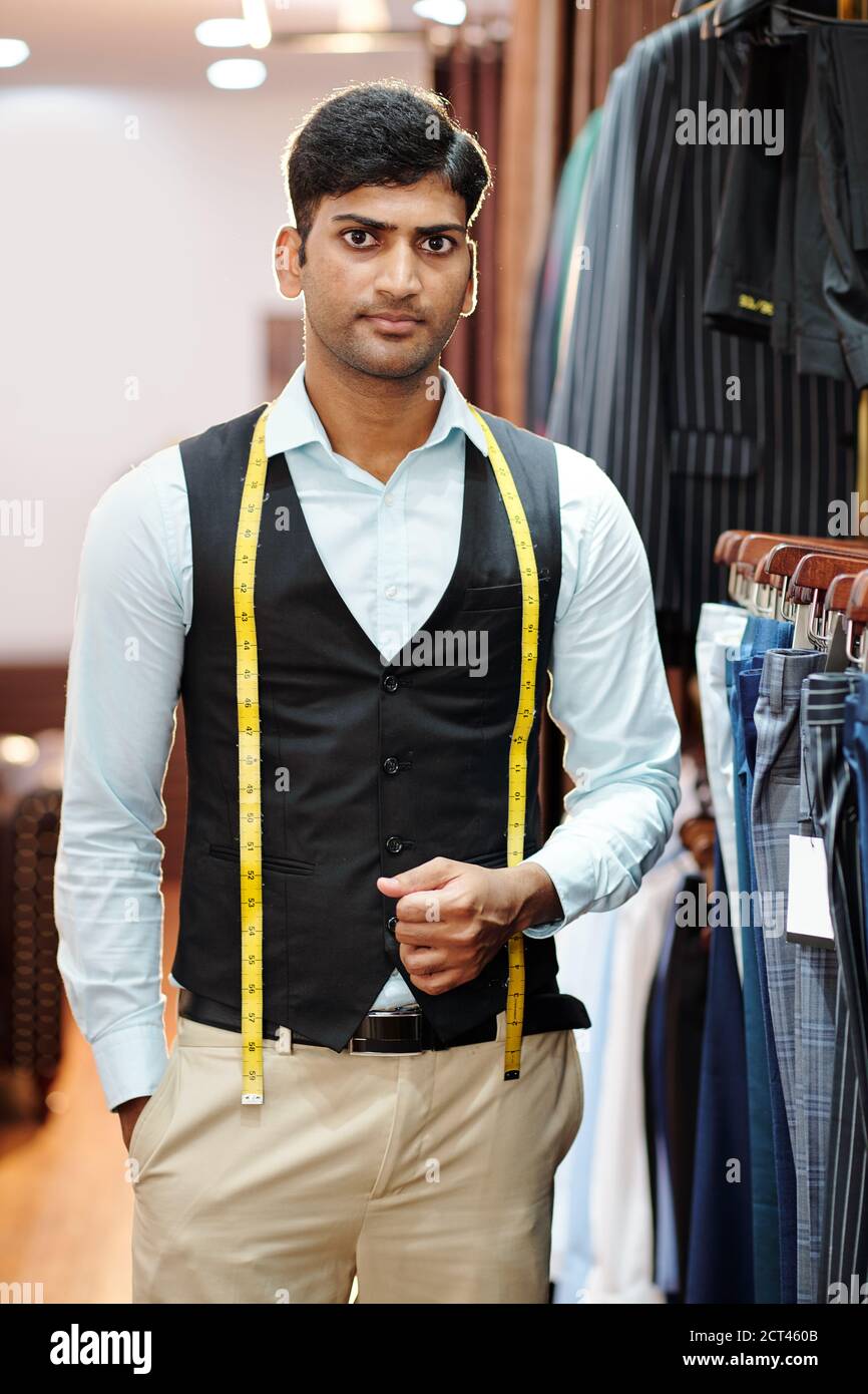 Tailor with measuring tape Stock Photo - Alamy