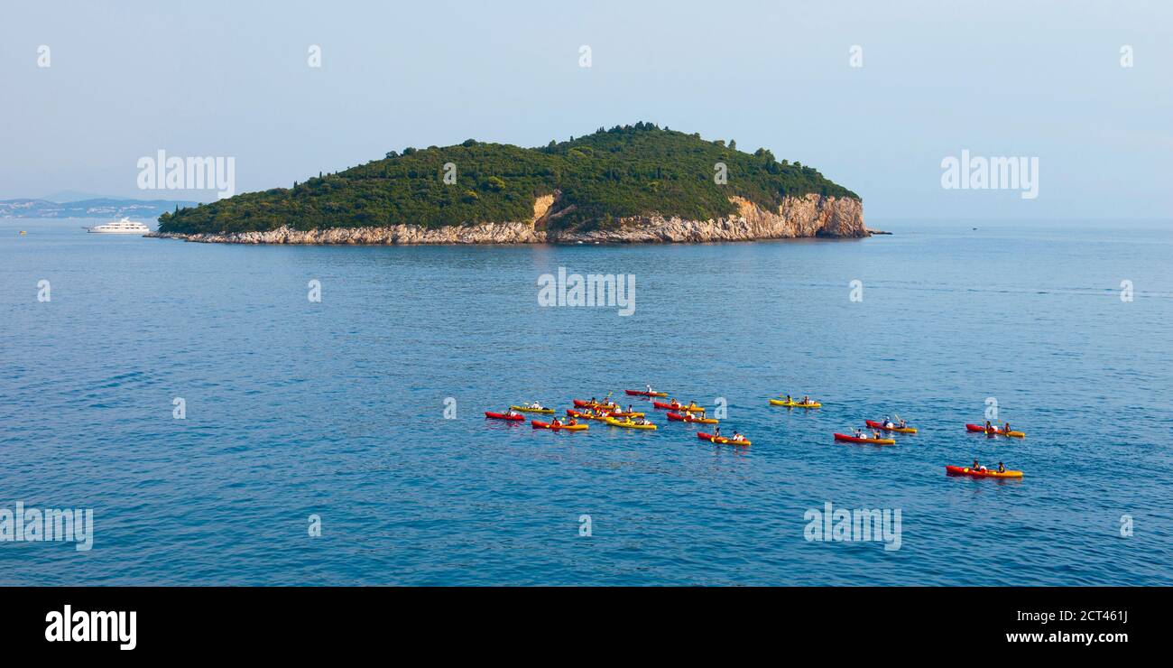 Panoramic photo of sea kayaking in Dubrovnik, tourists kayak past Buza ...