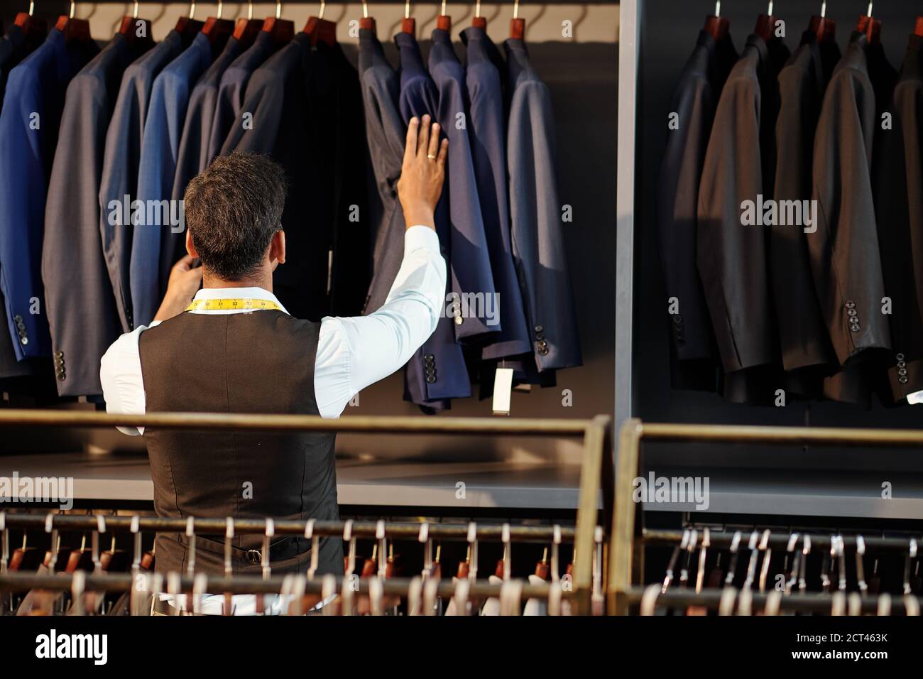 Clothing store owner checking hi-res stock photography and images - Alamy