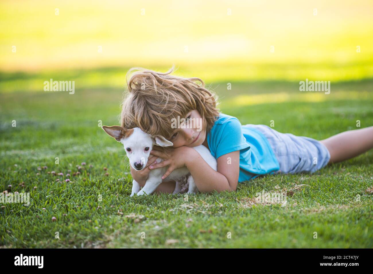 Hug dog friends. Child with puppies doggy kissing and hugging Stock ...