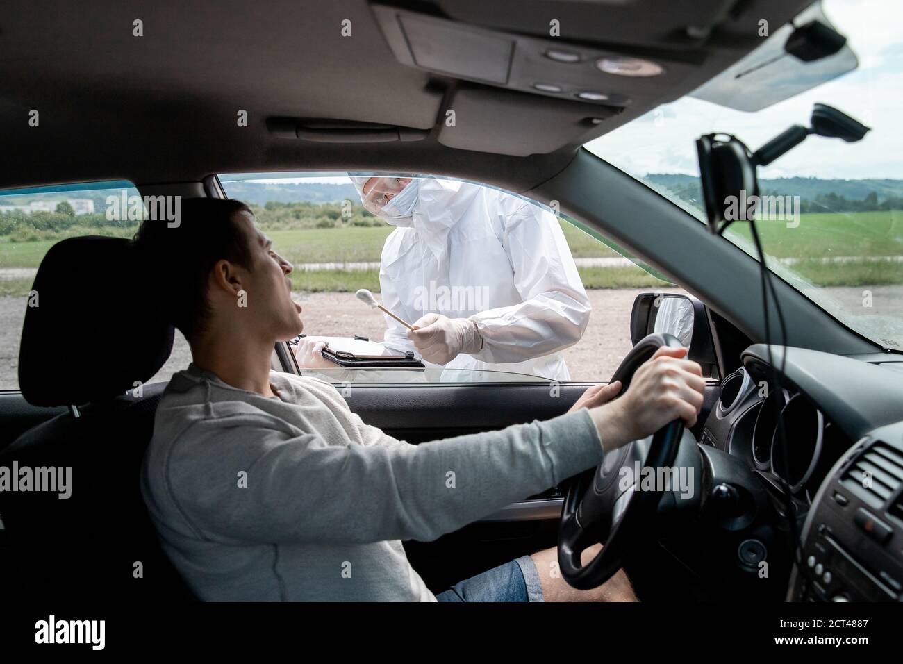 Checking and disinfecting car for virus COVID-19 and bubonic plague ...