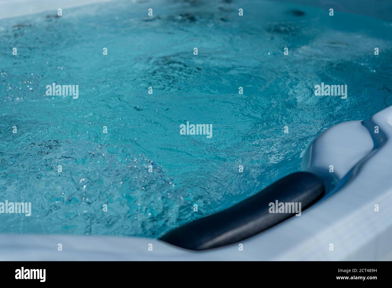 Luxury SPA. Closeup of water in hot bath tubs at spa. Blue clear fresh ...