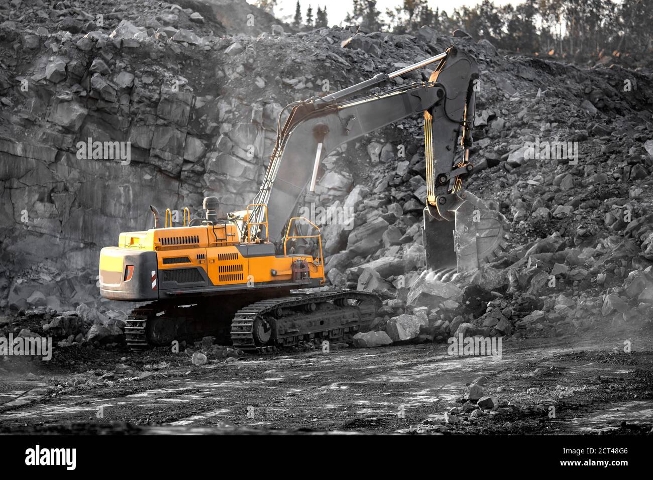 Excavator work loading of coal into Yellow mining truck. Open pit mine ...