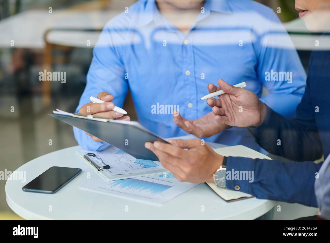 Analyzing financial documents Stock Photo - Alamy