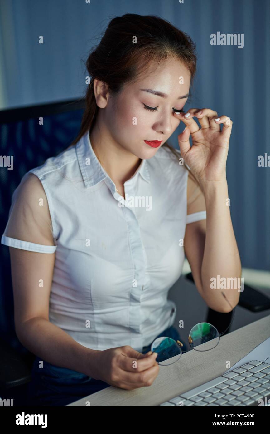 Young serious asian businesswoman thinking hi-res stock photography and images - Alamy
