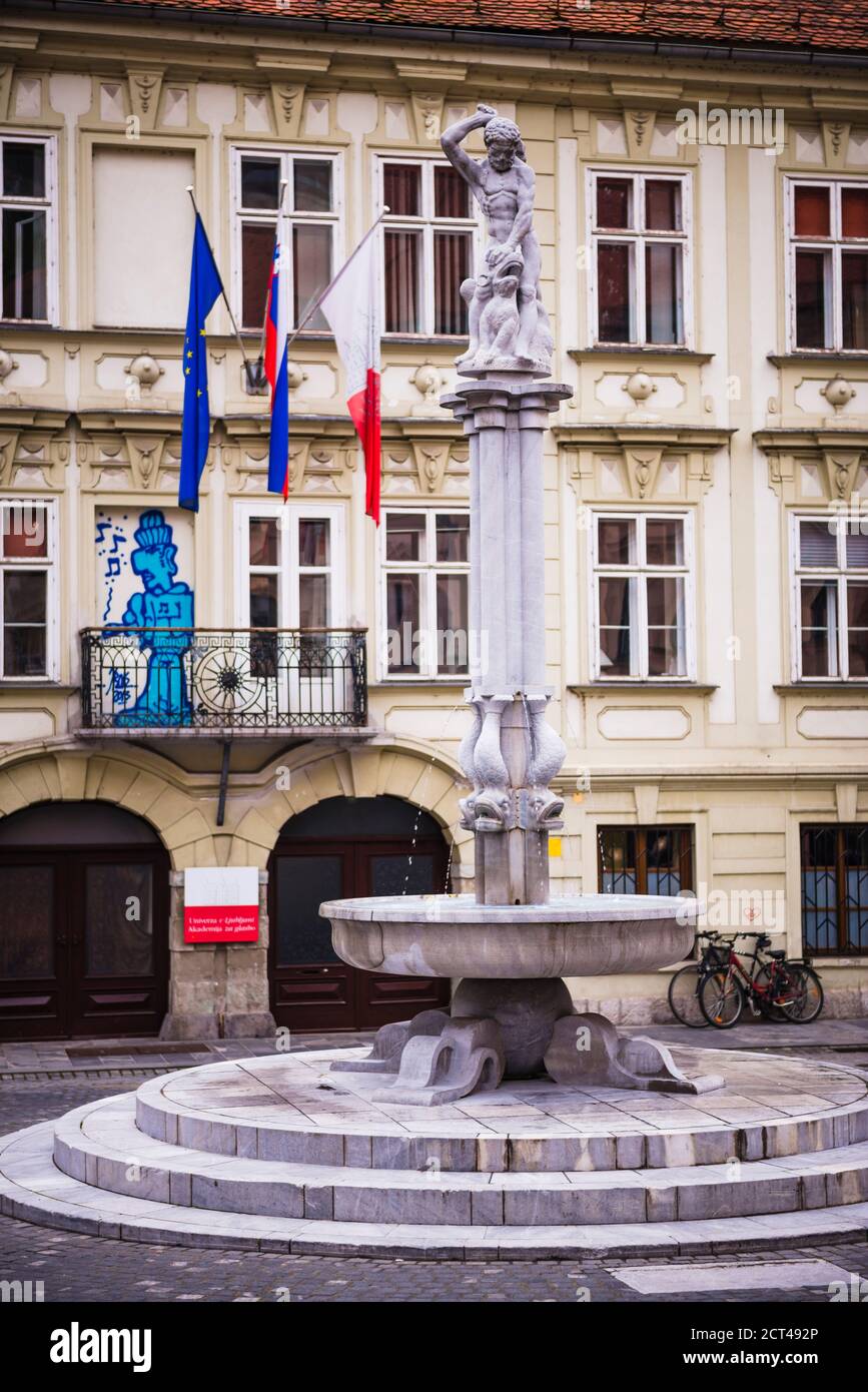 Ljubljana. Fountain and graffiti in Stari Trg Square, a cobbled square ...