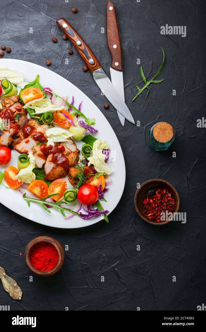 Appetizing salad with tomato,cucumber,lettuce and meat steak.Sliced ...