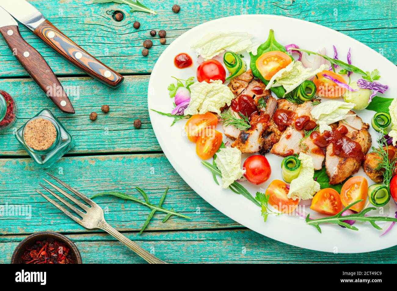 Appetizing salad with tomato,cucumber,lettuce and meat steak.Sliced ...