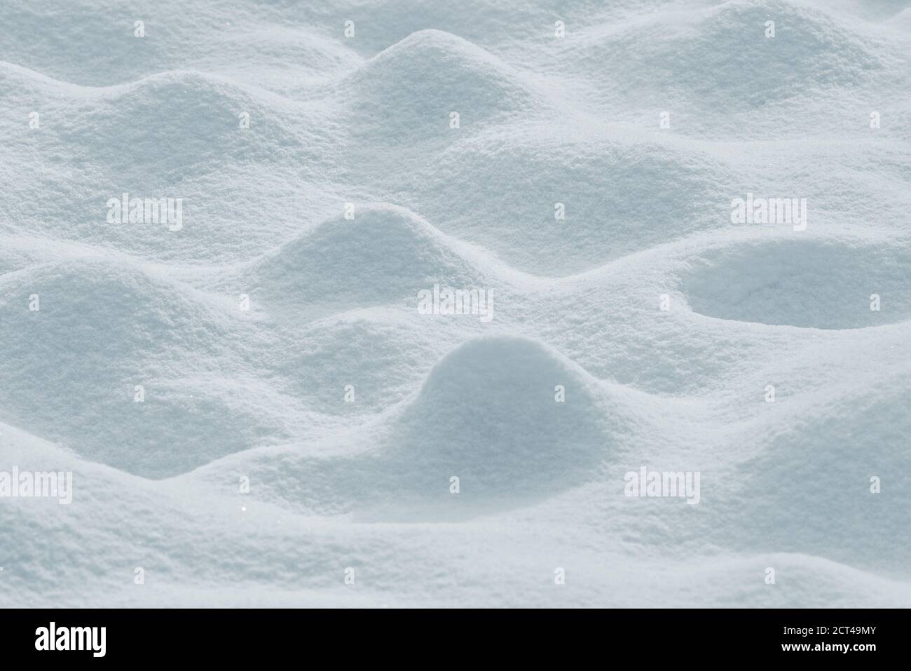 Hilly snow texture with selective focus Stock Photo - Alamy