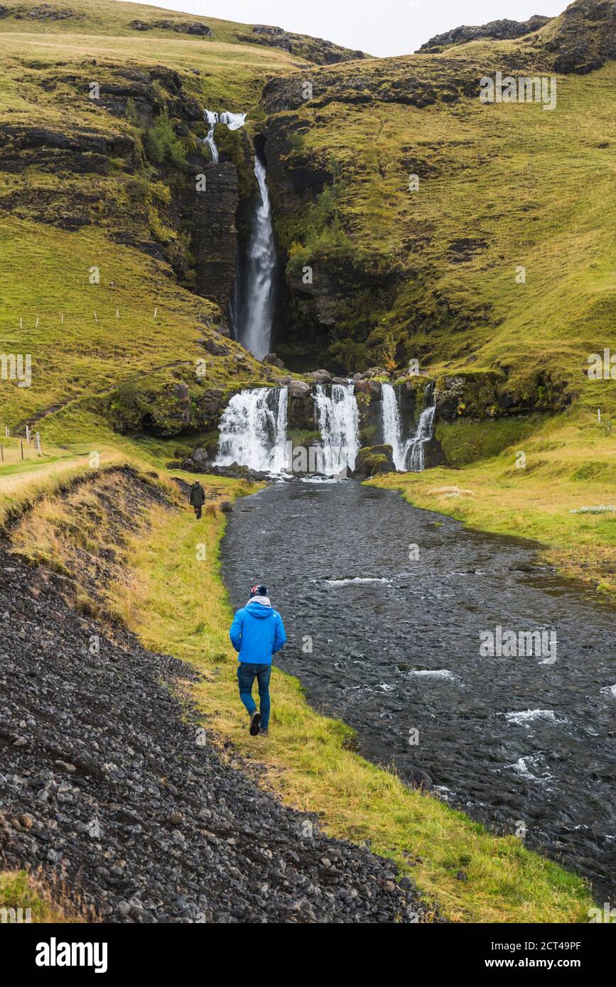 Tourist at Gluggafoss (Window Falls aka Merkjarfoss), a waterfall on ...