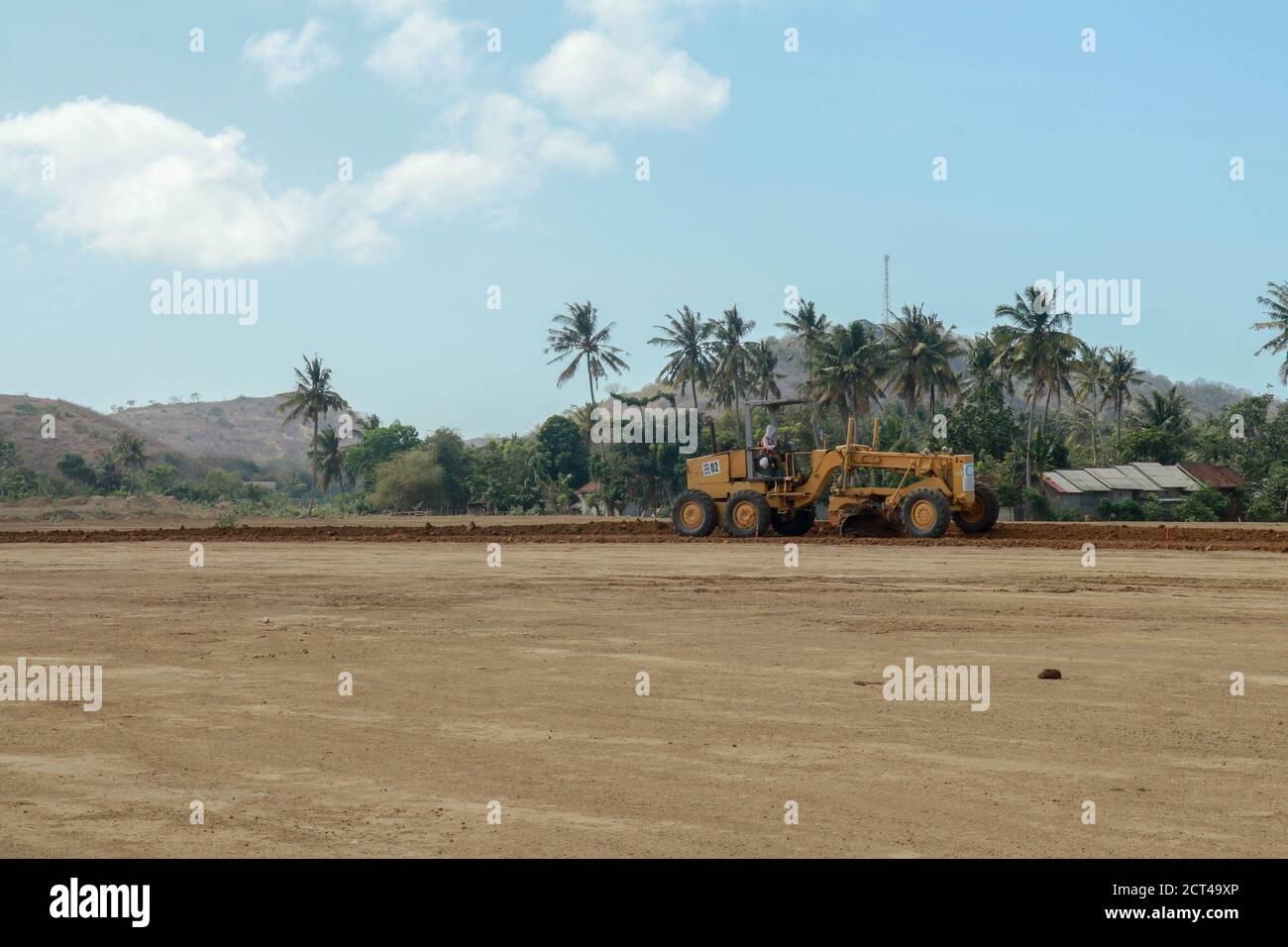 Working machines and heavy equipment adjust the terrain of the race ...