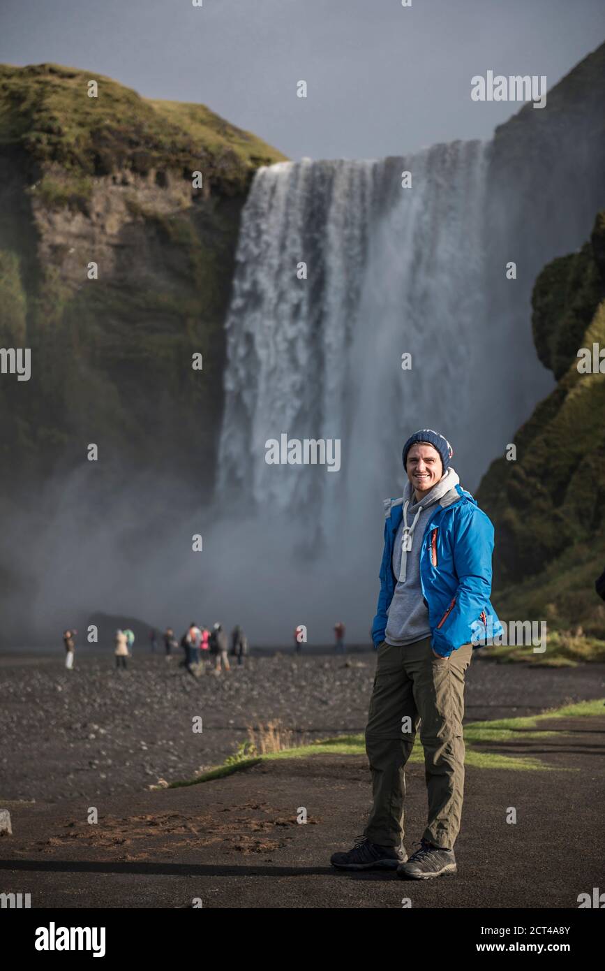 Tourist at Skogafoss Waterfall, Skogar, South Region (Sudurland ...