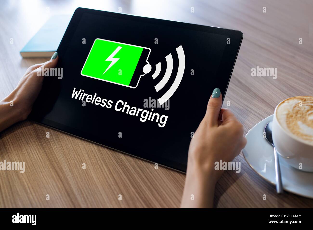 Wireless charging icons and progress bar on device screen Stock Photo ...