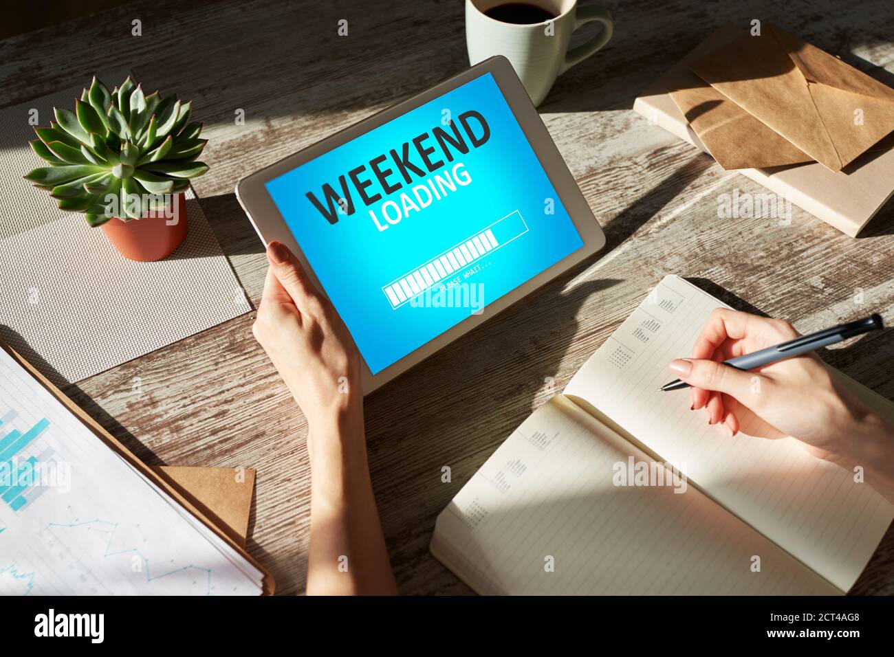 Weekend loading status bar message on device screen Stock Photo - Alamy