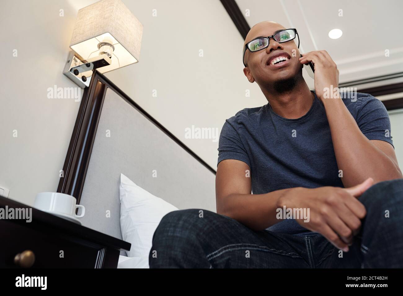 Cheerful african man calling phone hi-res stock photography and images ...