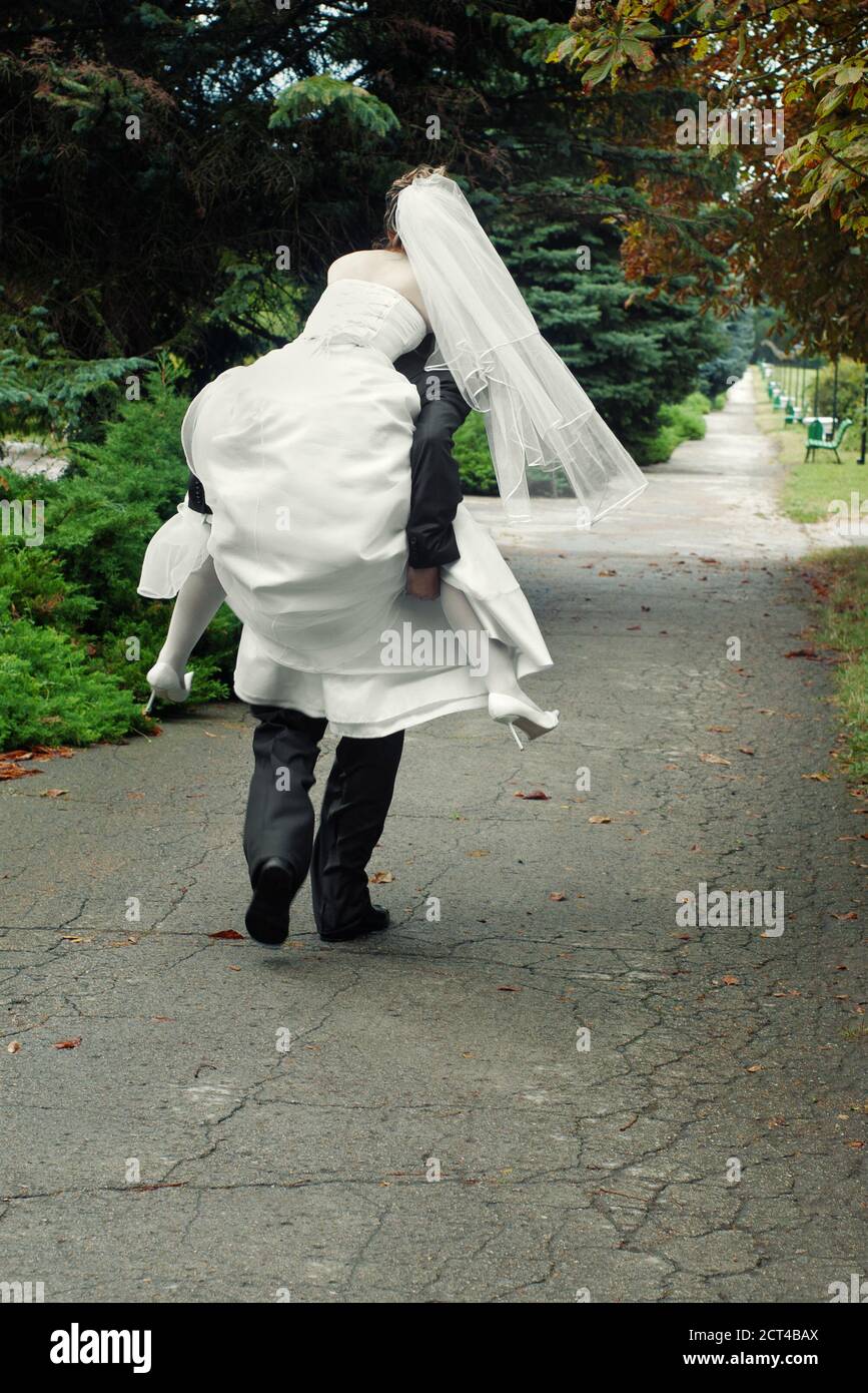 Bride running away hi-res stock photography and images - Alamy