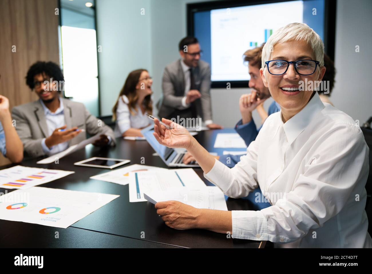 Creative business people working on business project in office Stock ...