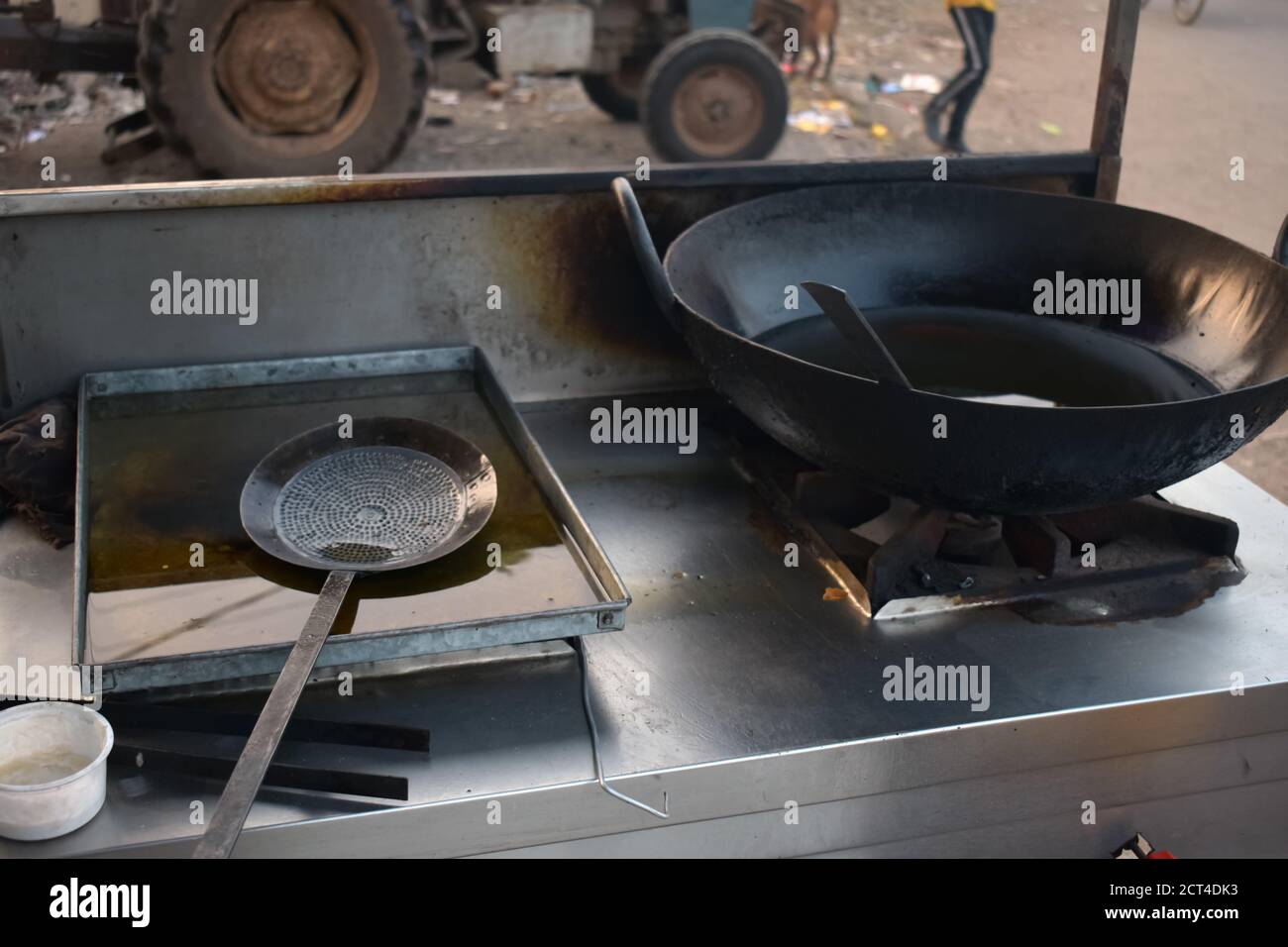 Composition of burnt and dirty fryers in a kitchen Stock Photo - Alamy