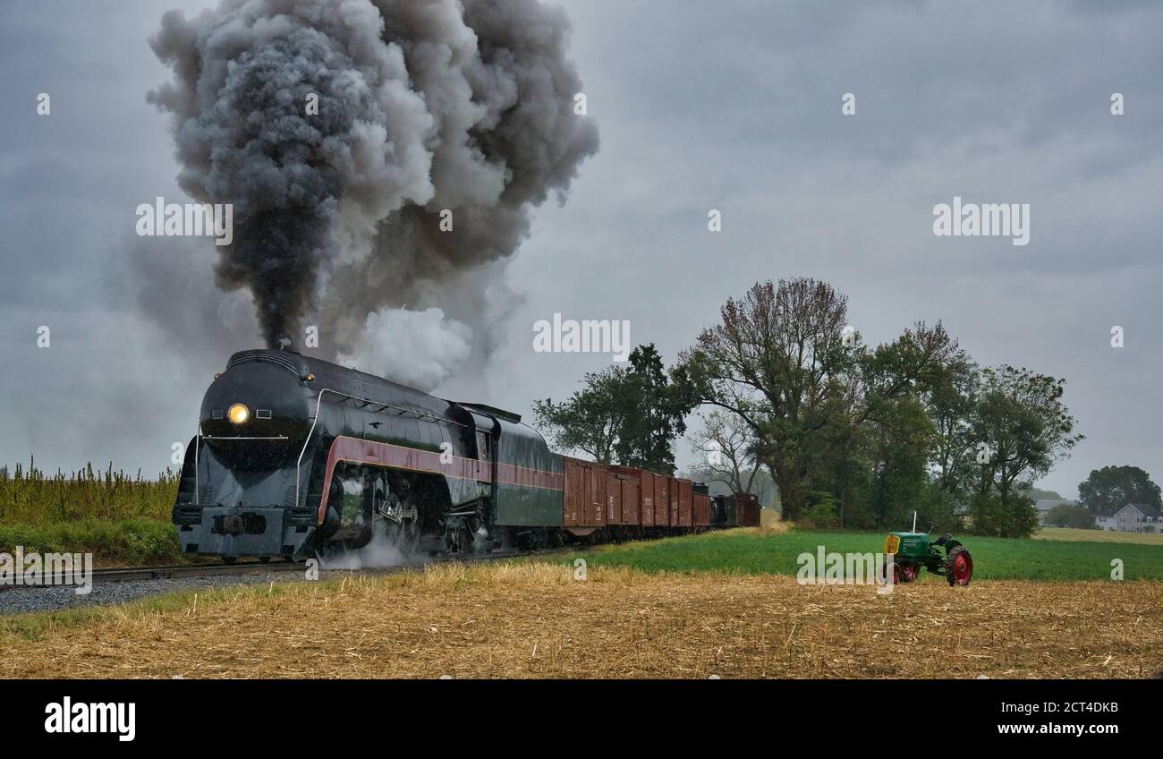 Antique steam train engine puffing Stock Photo - Alamy