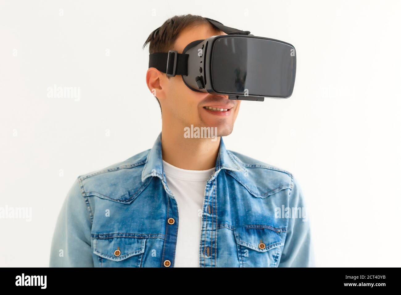 Man wearing virtual reality goggles. Studio shot, gray backgroun Stock ...