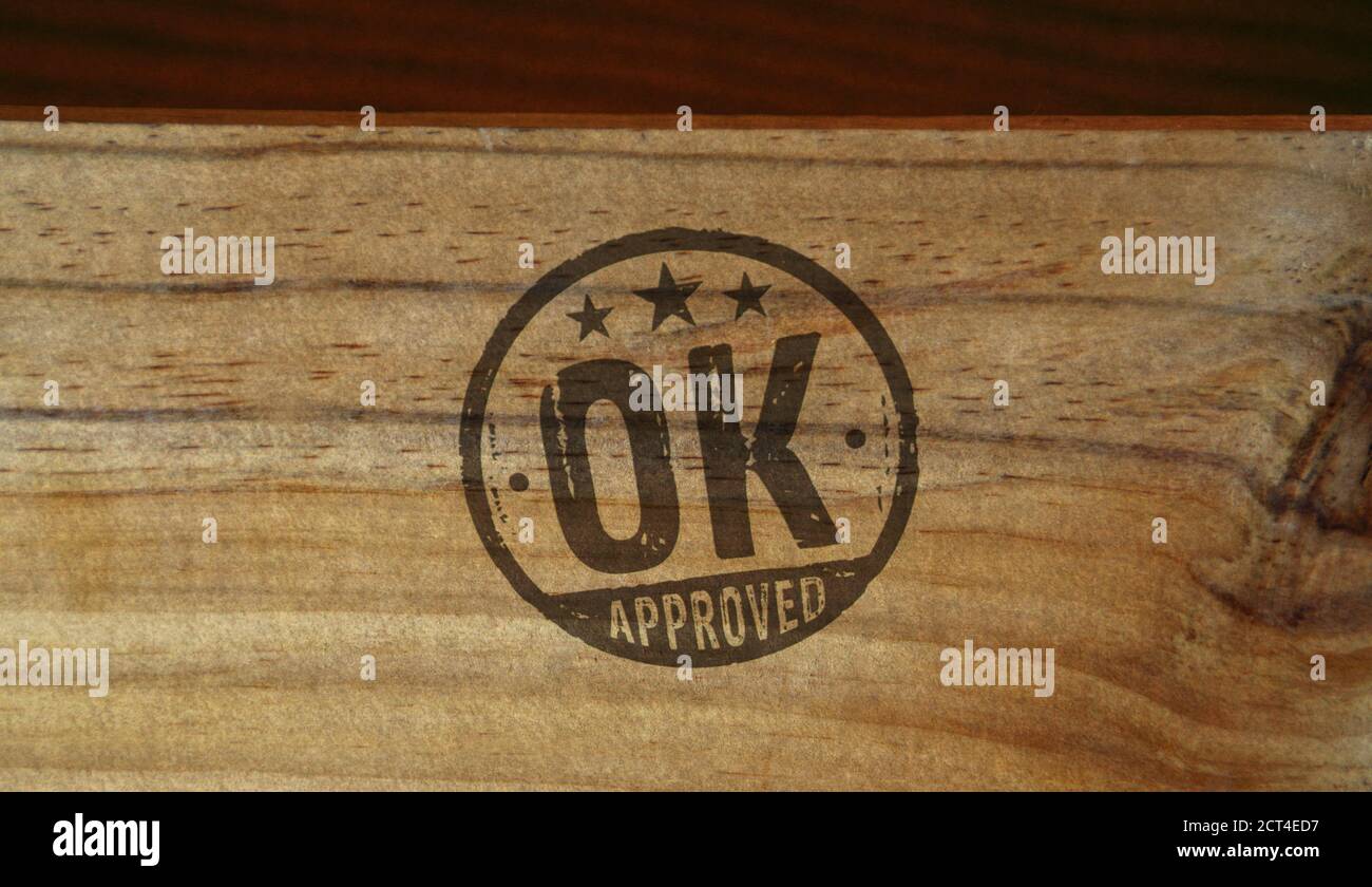 OK approved stamp printed on wooden box. Document accepted, admitted ...