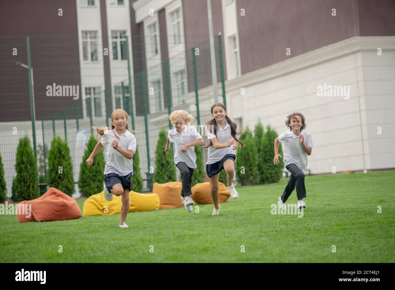 Children running school uniform hi-res stock photography and images - Alamy