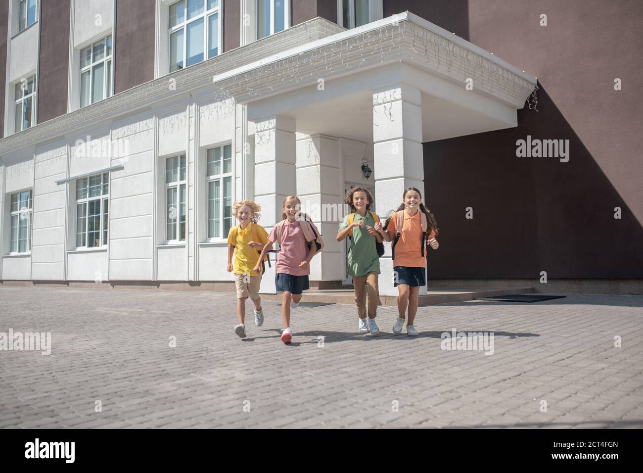 Kids leaving school building hi-res stock photography and images - Alamy