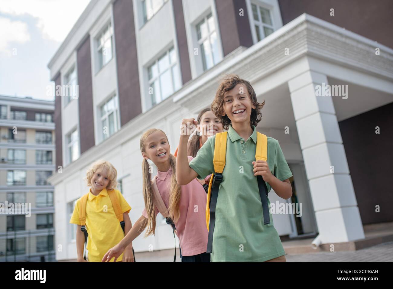 Schoolchildren playing in school yard and feeling good Stock Photo - Alamy