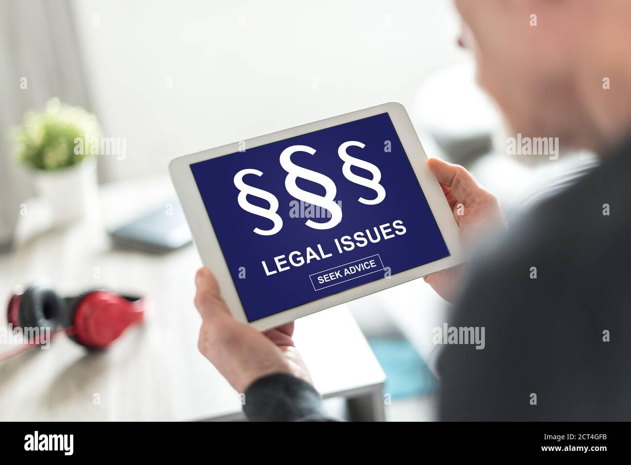 Tablet screen displaying a legal issues concept Stock Photo - Alamy