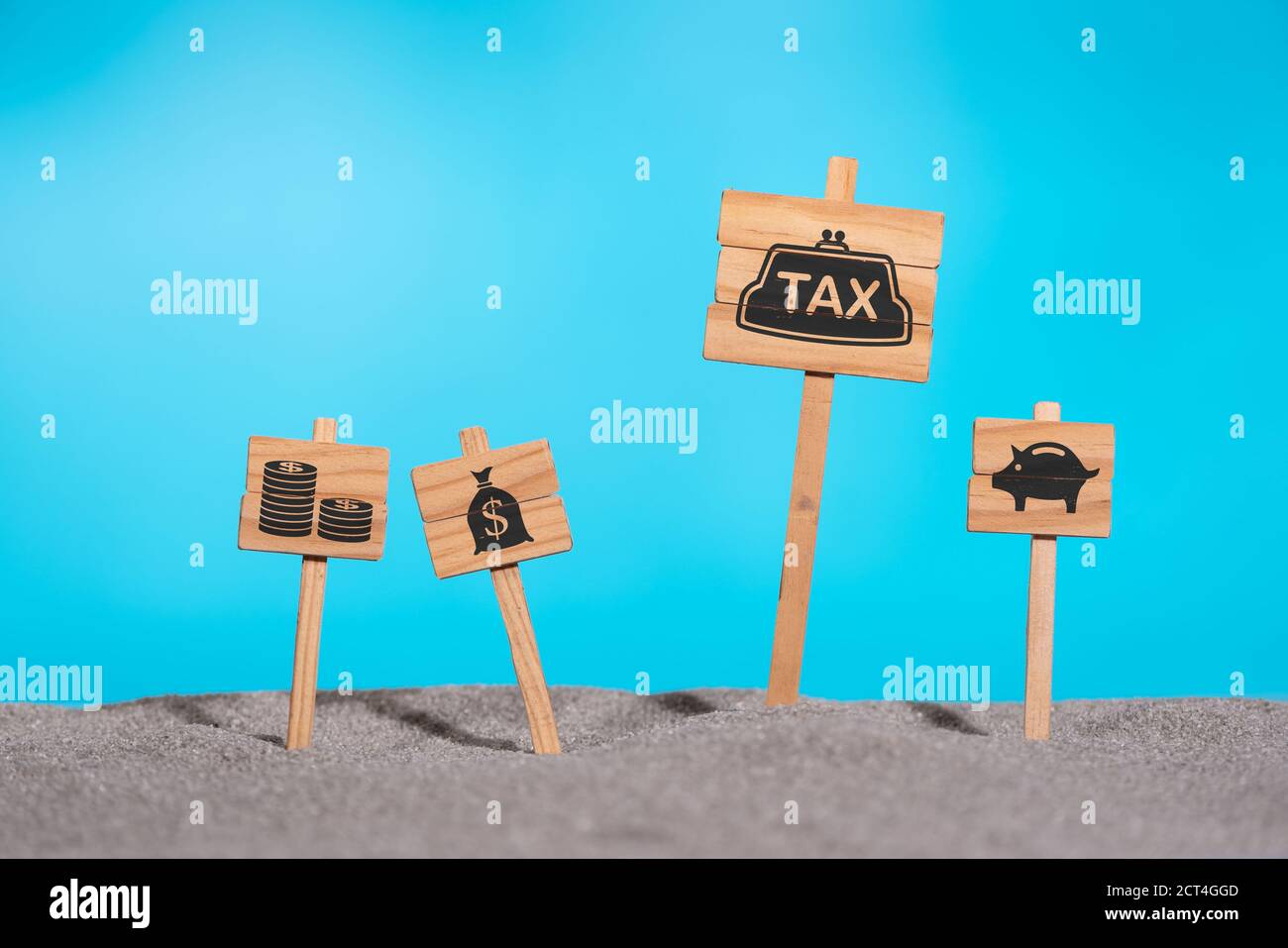 Concept of tax with icons on wooden signs Stock Photo - Alamy